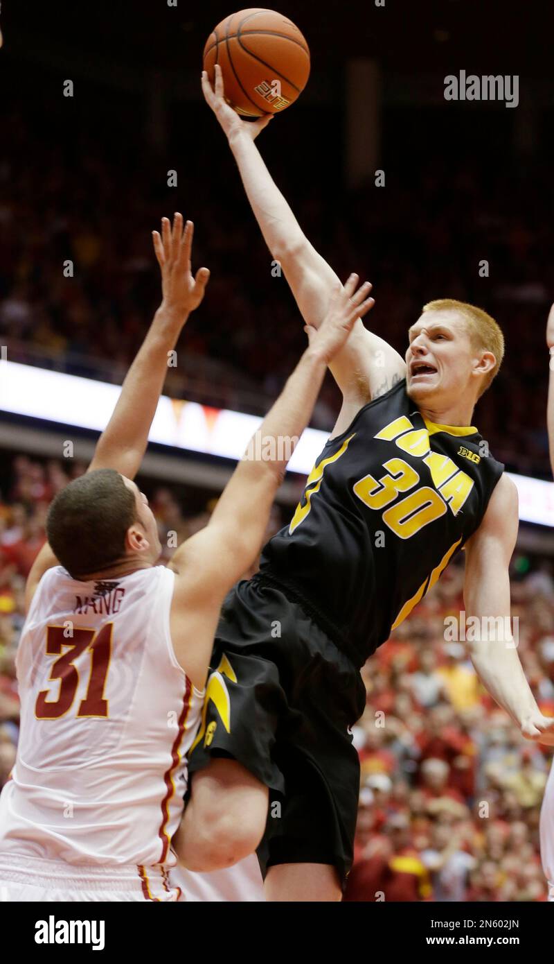 Iowa forward Aaron White (30) shoots over Iowa State forward Georges ...