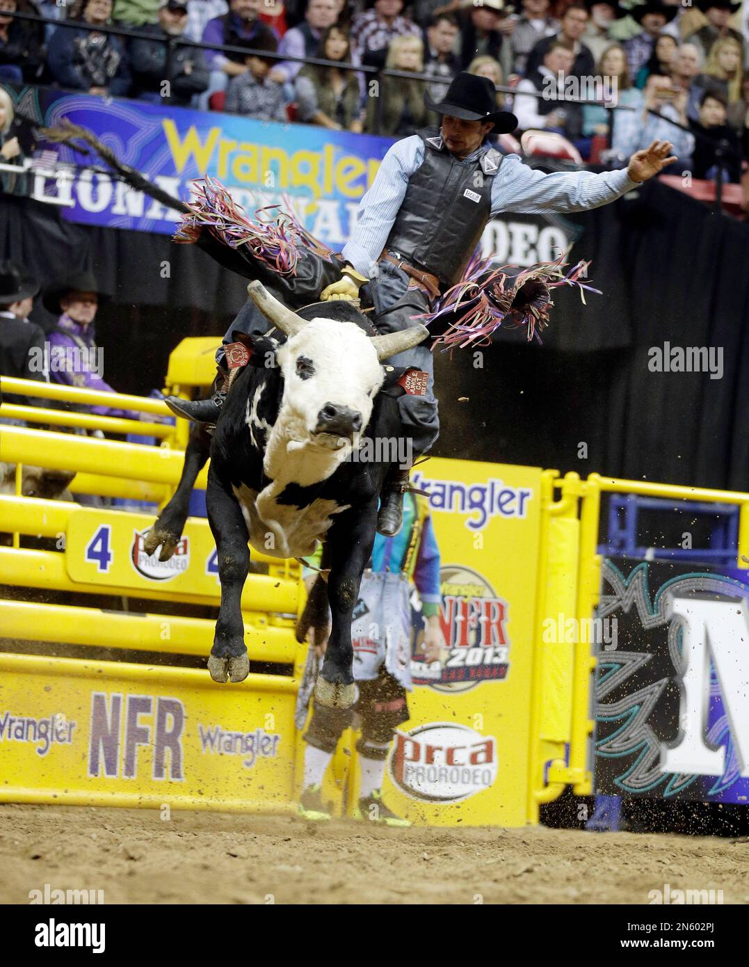 Elliot Jacoby rides Jungle Cat during the bull riding competition at ...
