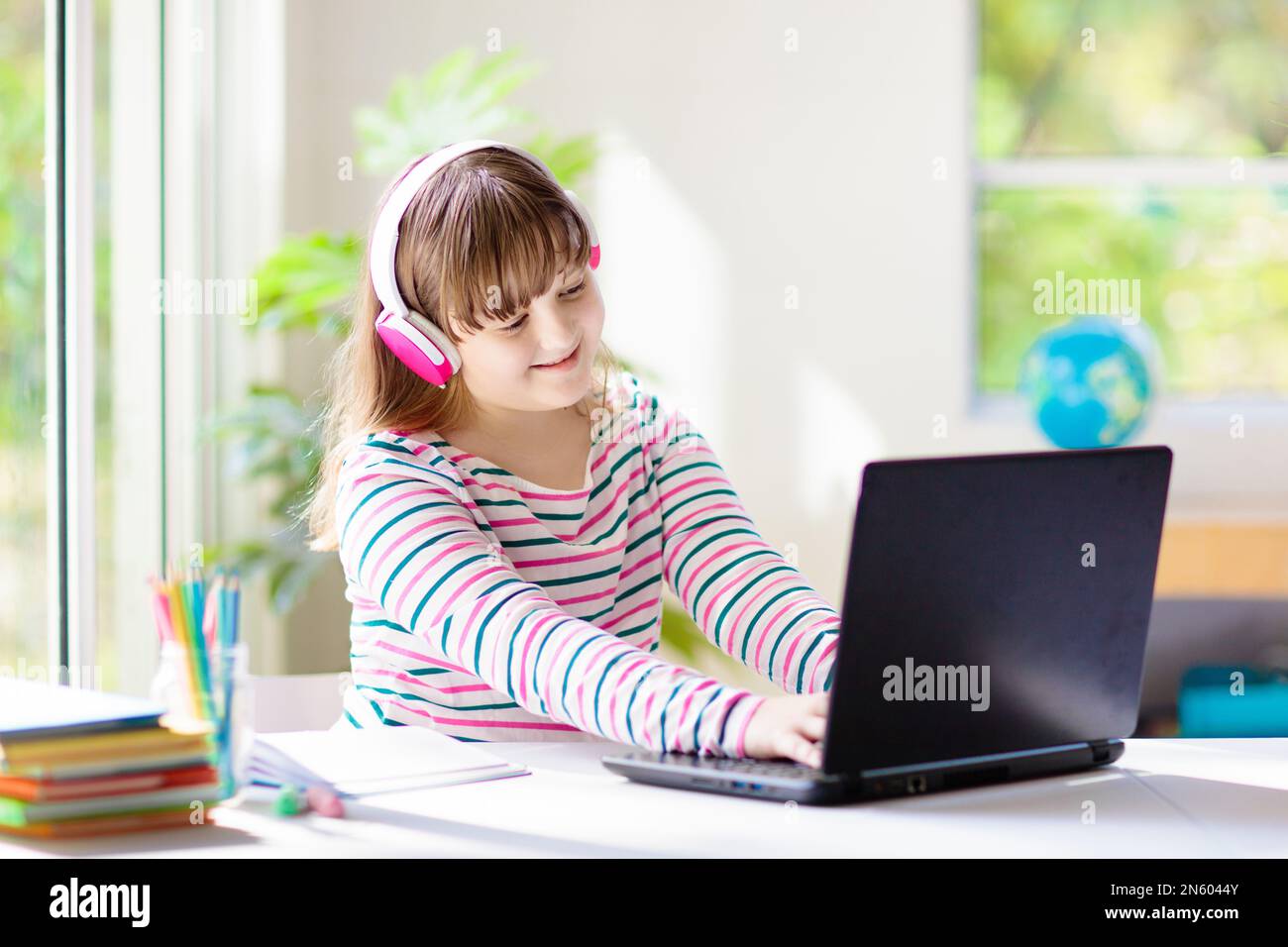 Teenage girl writing or drawing in notebook. Online art class. School ...