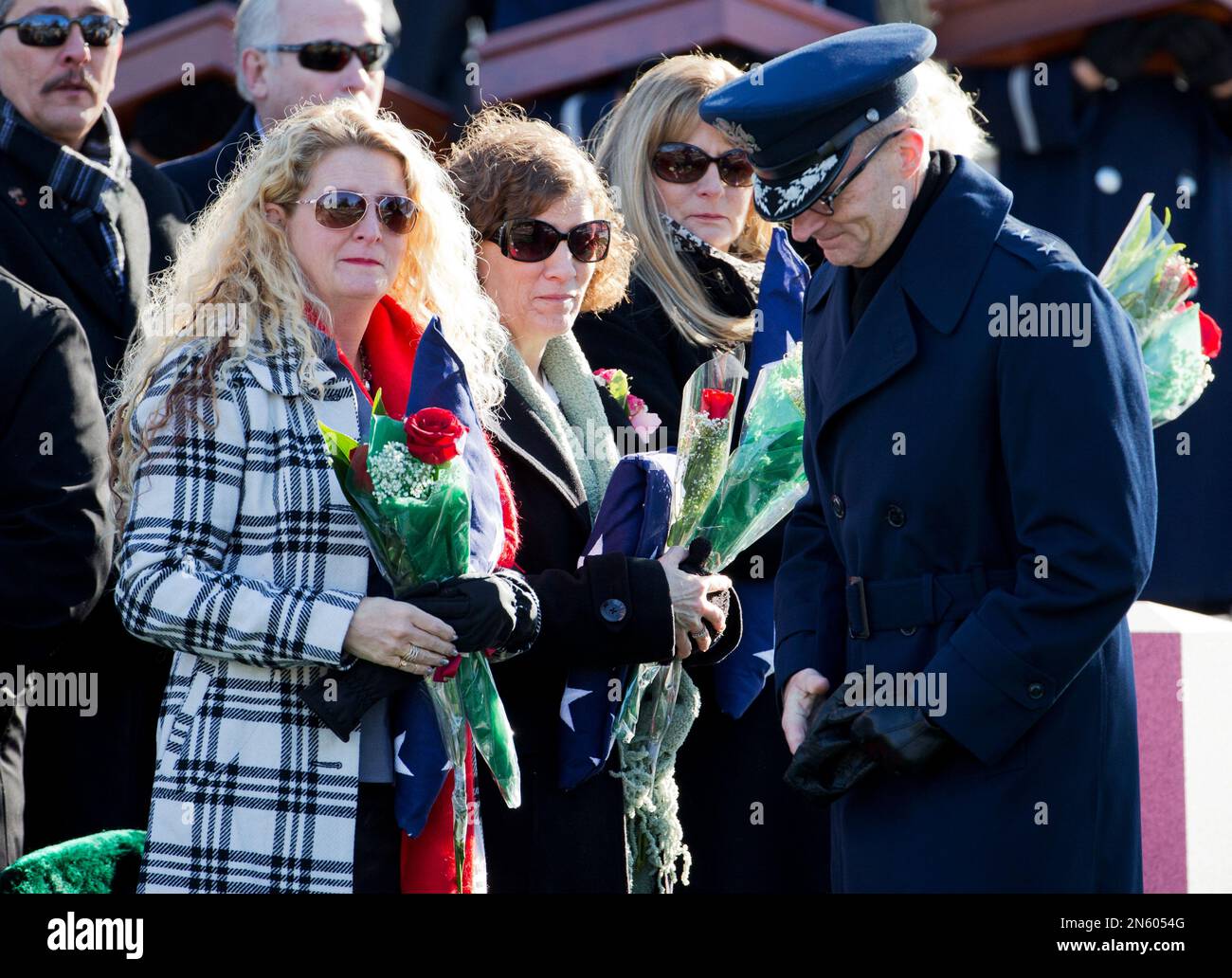 Maj. Gen. Steven Lepper, right, consoles the daughters of U.S. Air ...