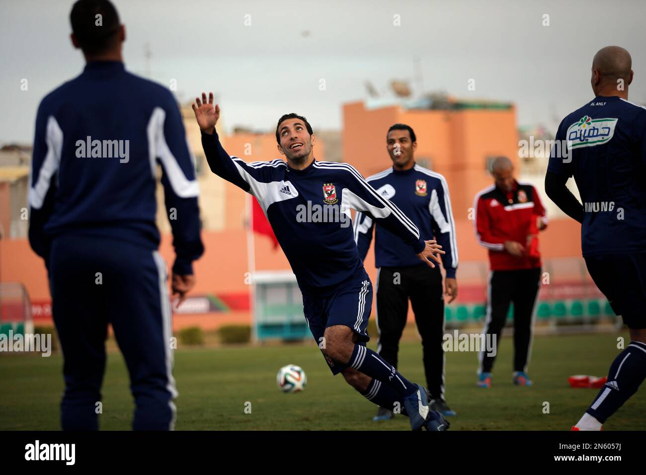 Al Ahly SC's Mohamed Aboutrika, center, runs during a training session ...