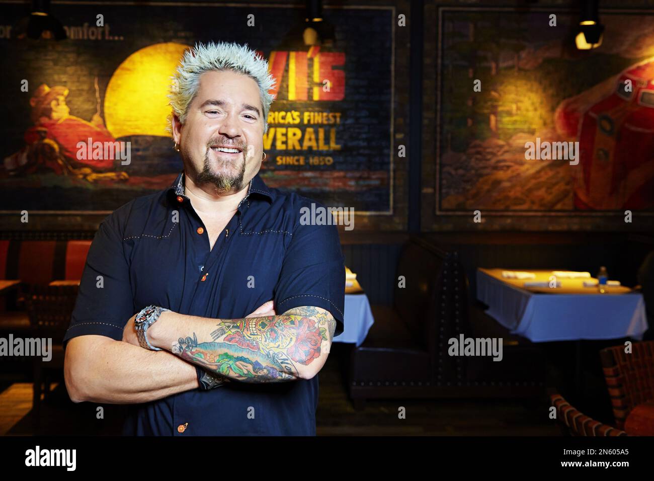 Guy Fieri poses for a portrait, on Monday, Dec. 9, 2013 in New York ...