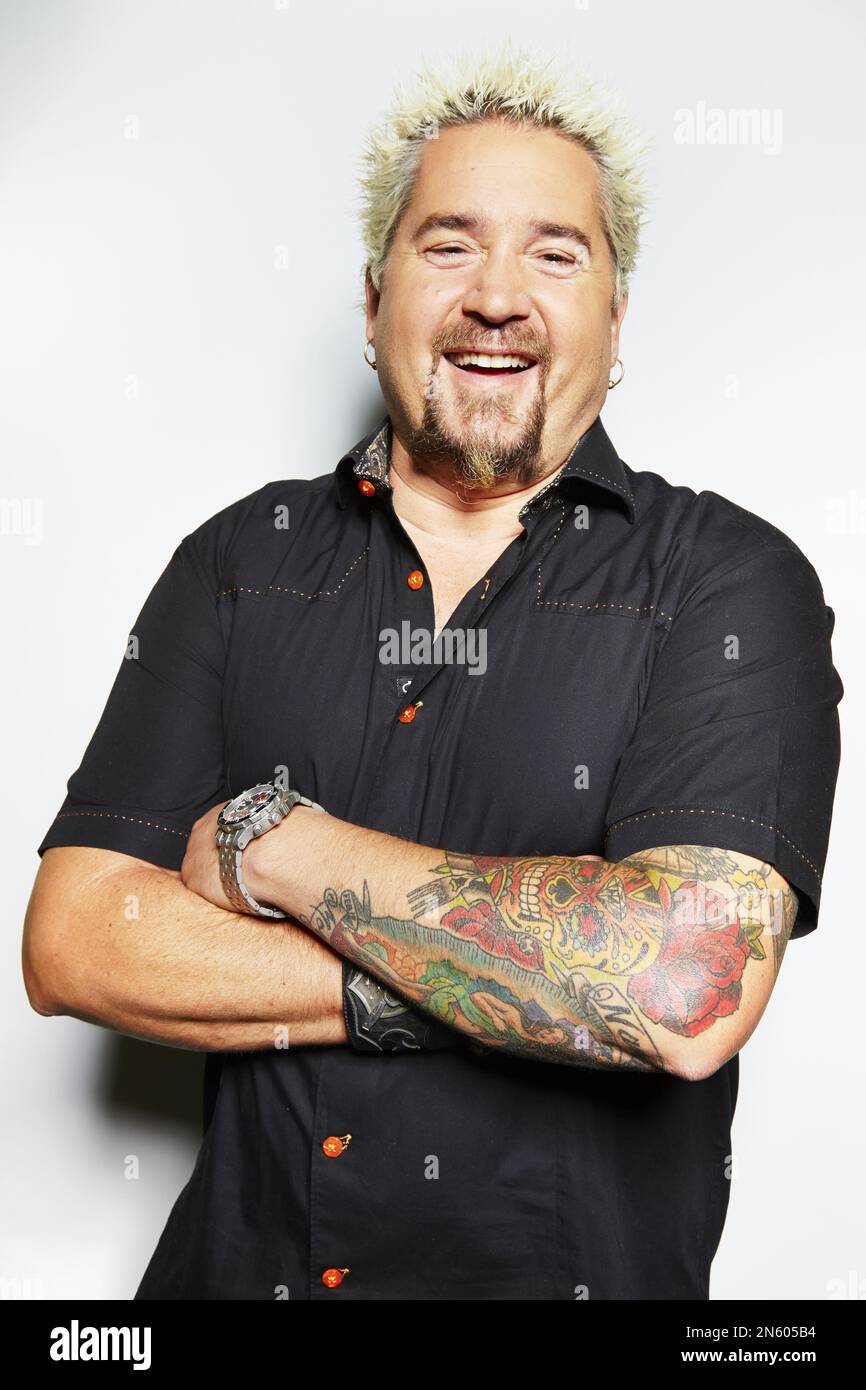Guy Fieri poses for a portrait, on Monday, Dec. 9, 2013 in New York ...