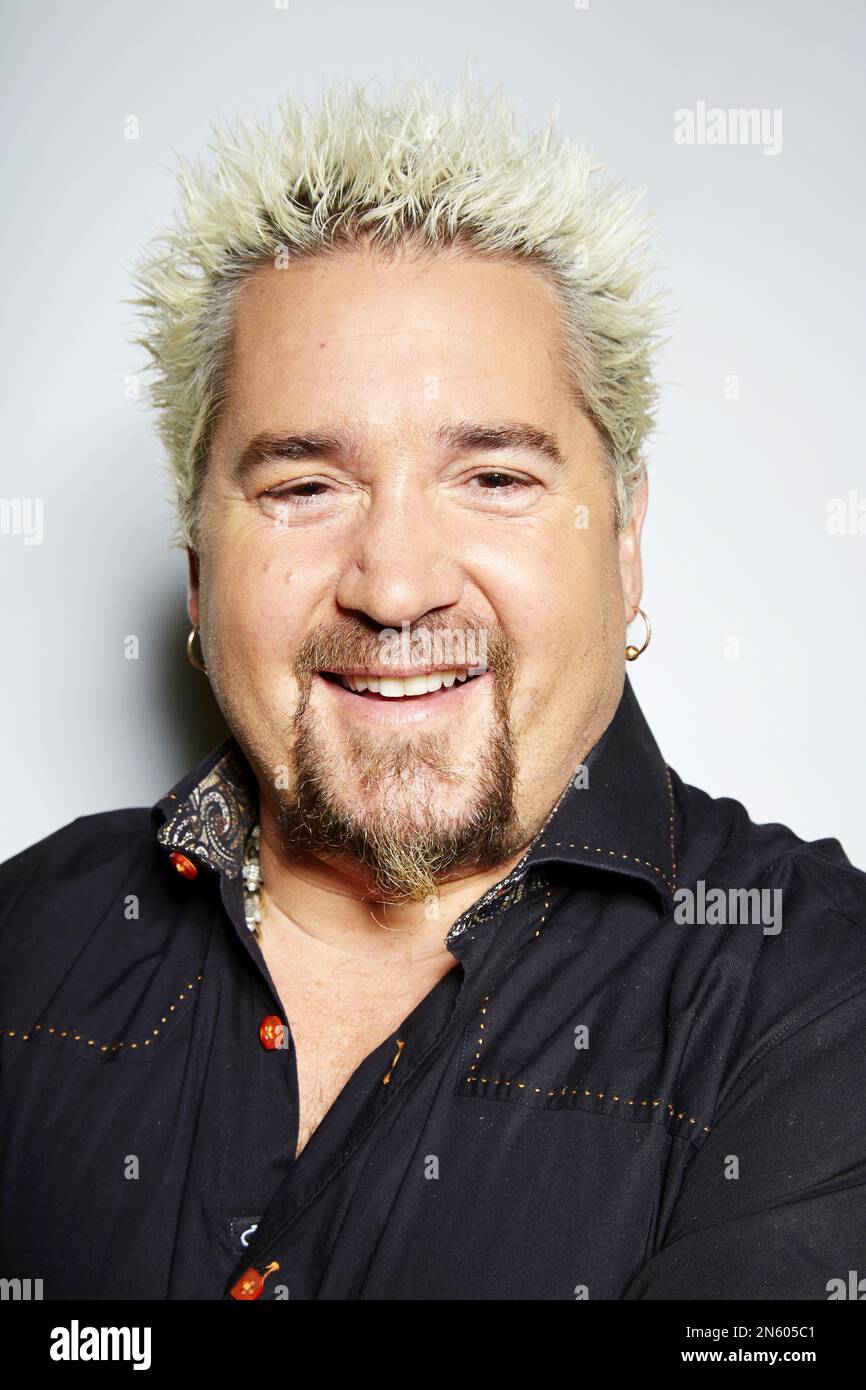 Guy Fieri poses for a portrait, on Monday, Dec. 9, 2013 in New York ...