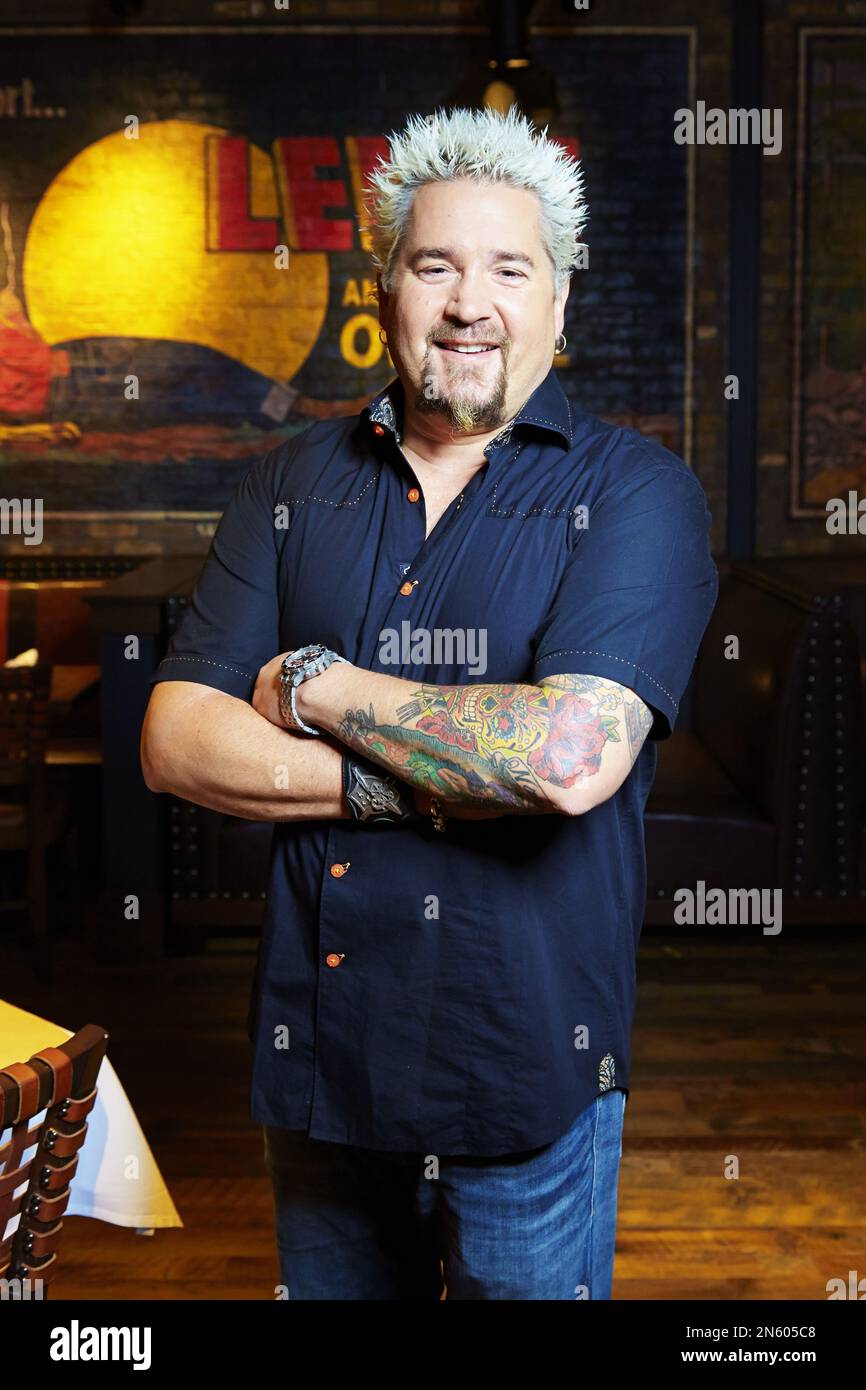 Guy Fieri poses for a portrait, on Monday, Dec. 9, 2013 in New York ...