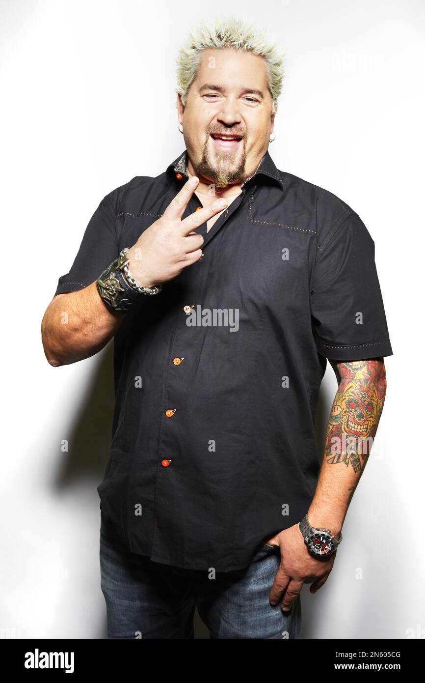 Guy Fieri poses for a portrait, on Monday, Dec. 9, 2013 in New York ...