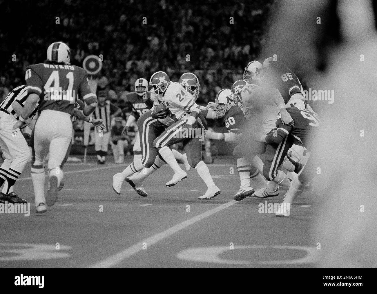 The AFC's Otis Armstrong (24) of the Broncos, is pulled by the NFC's ...