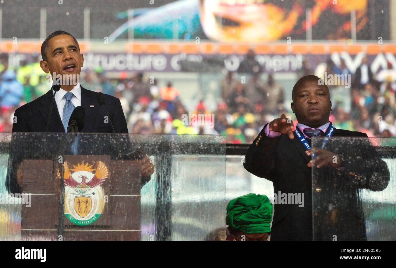 FILE - In this file photo from Dec.10, 2013, Thamsanqa Jantjie, right ...