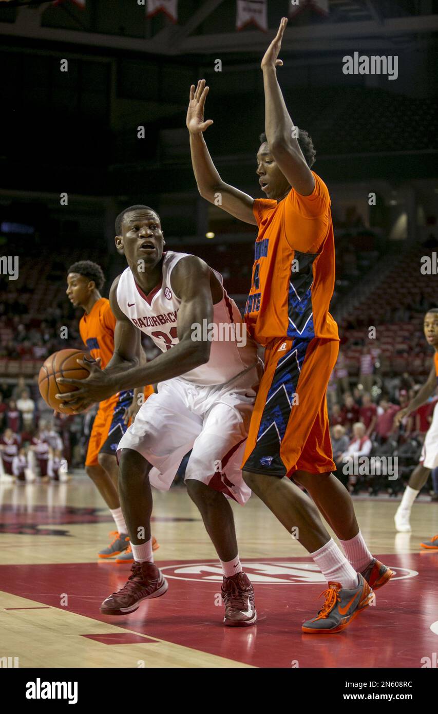 Arkansas center Moses Kingsley, left, looks to shoot against Savannah ...