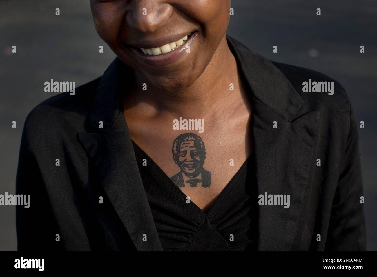 Nkele Khunalo poses for a portrait bearing a transfer of Nelson Mandela ...