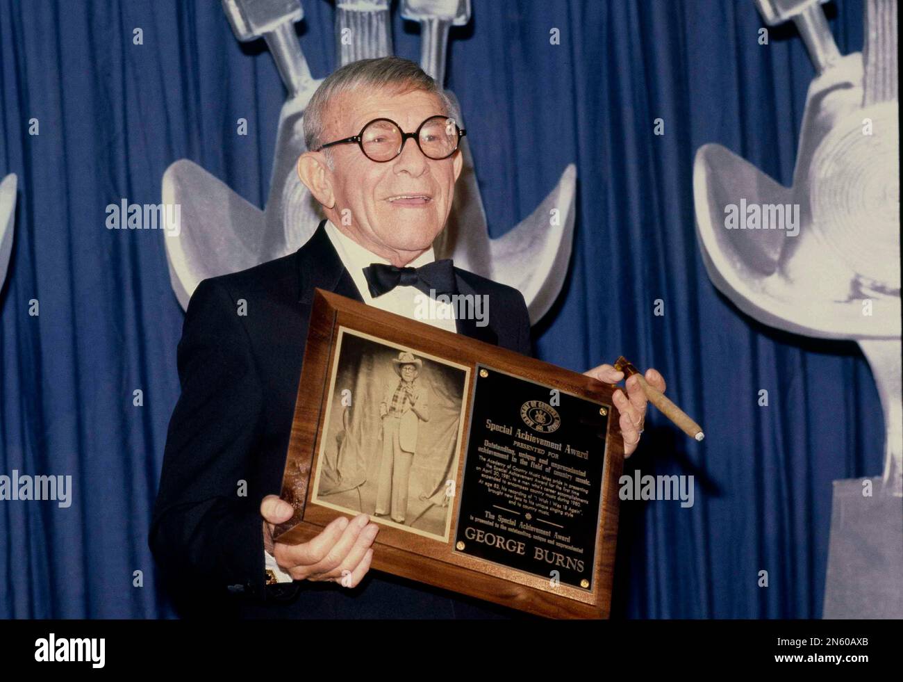 George Burns holds his Special Achievement award given to him at the ...