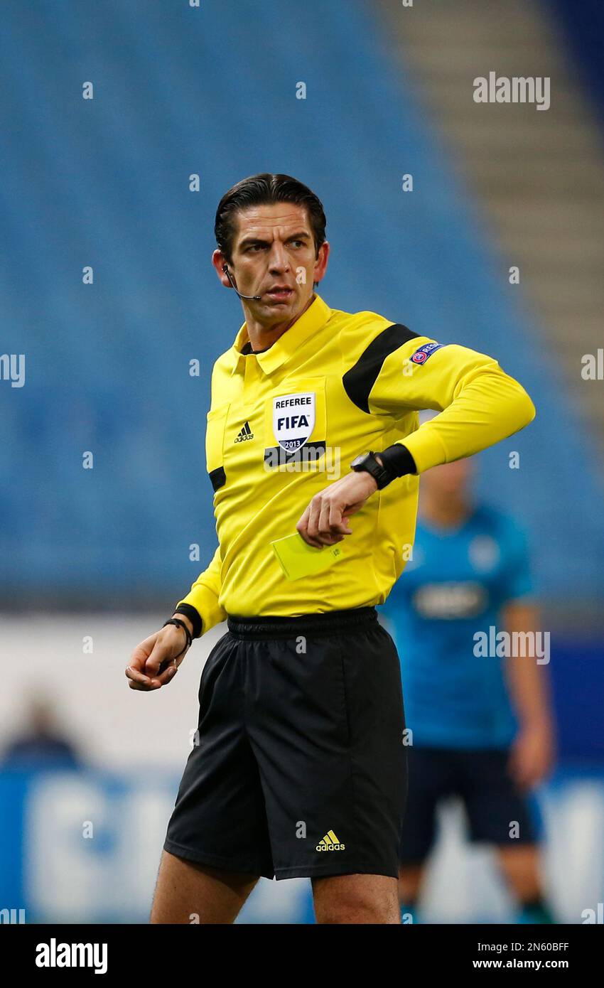 FIFA referee Deniz Aytekin of Germany takes out a yellow card during a ...