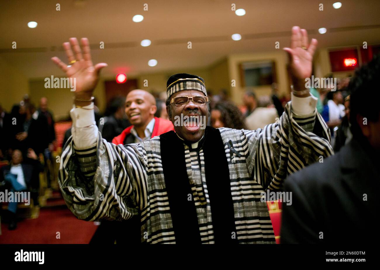 Cal Murrell, otherwise known as "The Happy Preacher," recites a chant ...