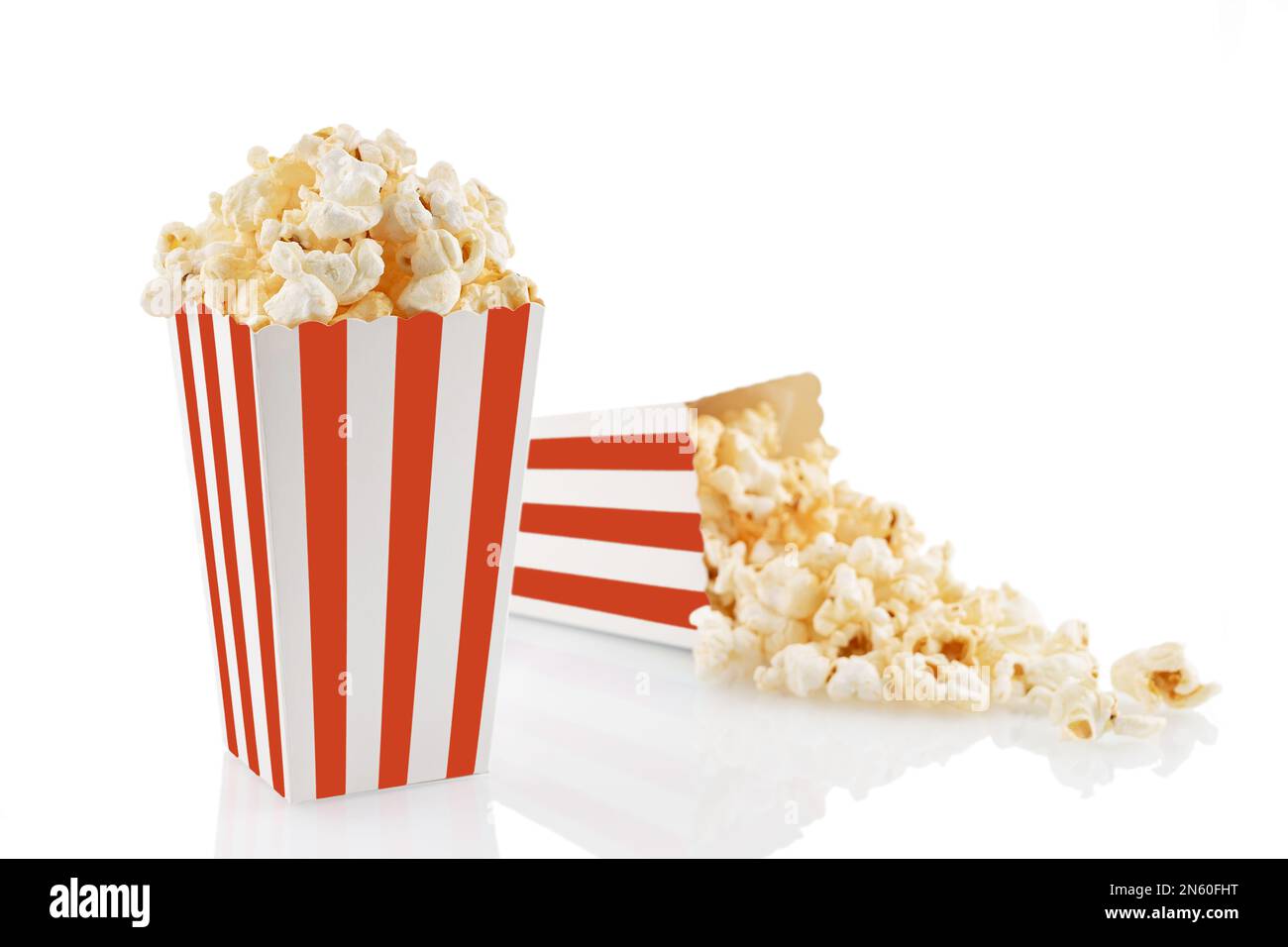 Two red white striped carton buckets with tasty cheese popcorn ...