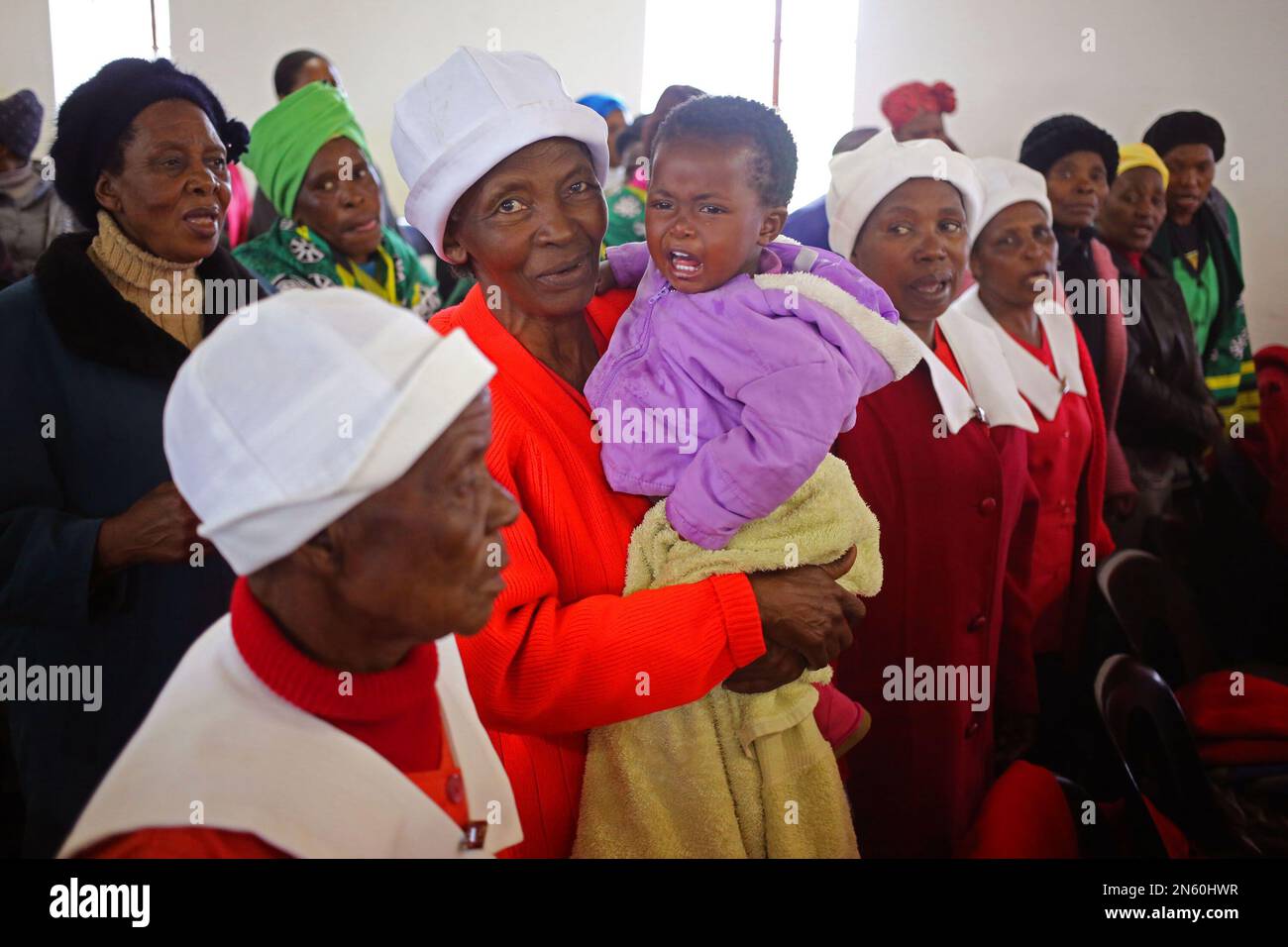 People sing after, praying for former South African president Nelson ...