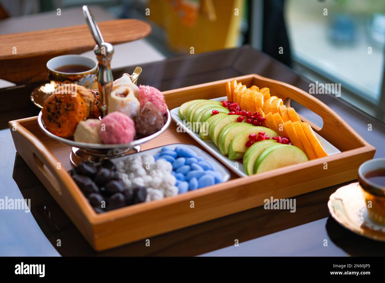 Tray of sweets and fruit served for tea Stock Photo - Alamy