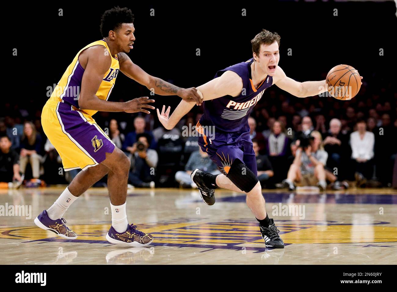 Los Angeles Lakers forward Nick Young, left, fouls Phoenix Suns guard ...