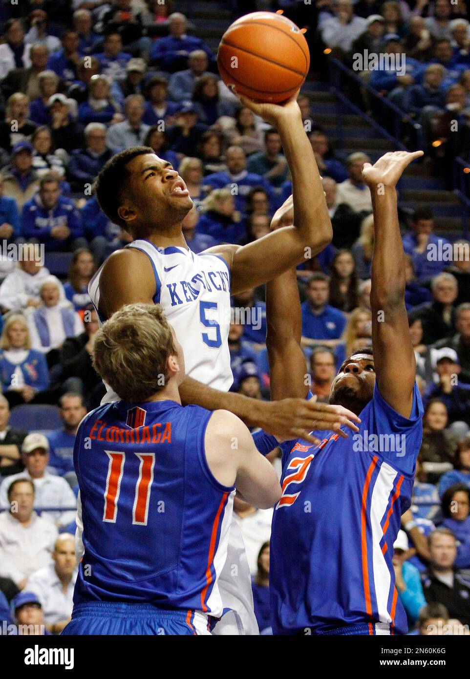 Kentucky's Andrew Harrison (5) shoots between Boise State's Jeff ...