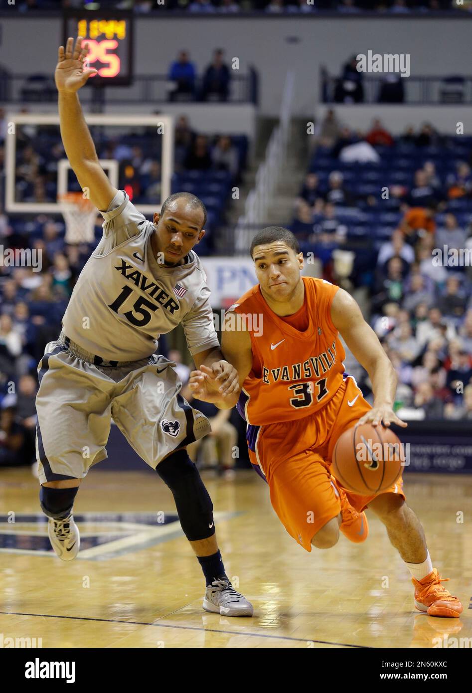 Evansville guard D.J. Balentine (31) drives against Xavier guard Myles ...