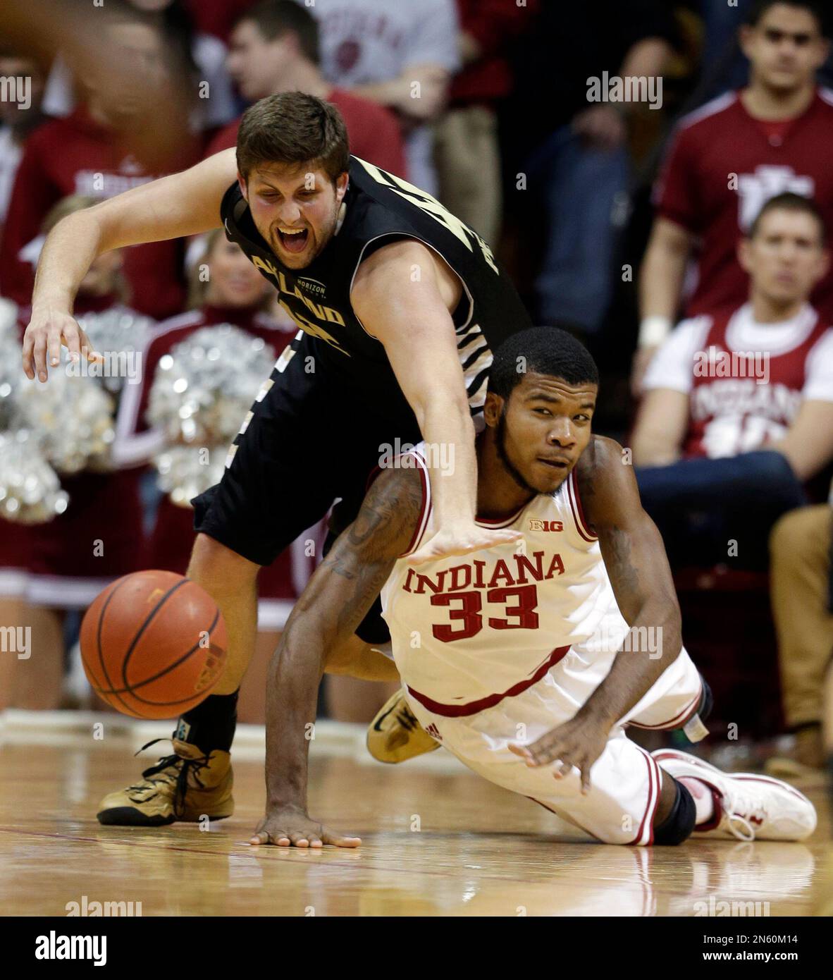 Indiana's Jeremy Hollowell (33) and Oakland's Corey Petros go for a ...