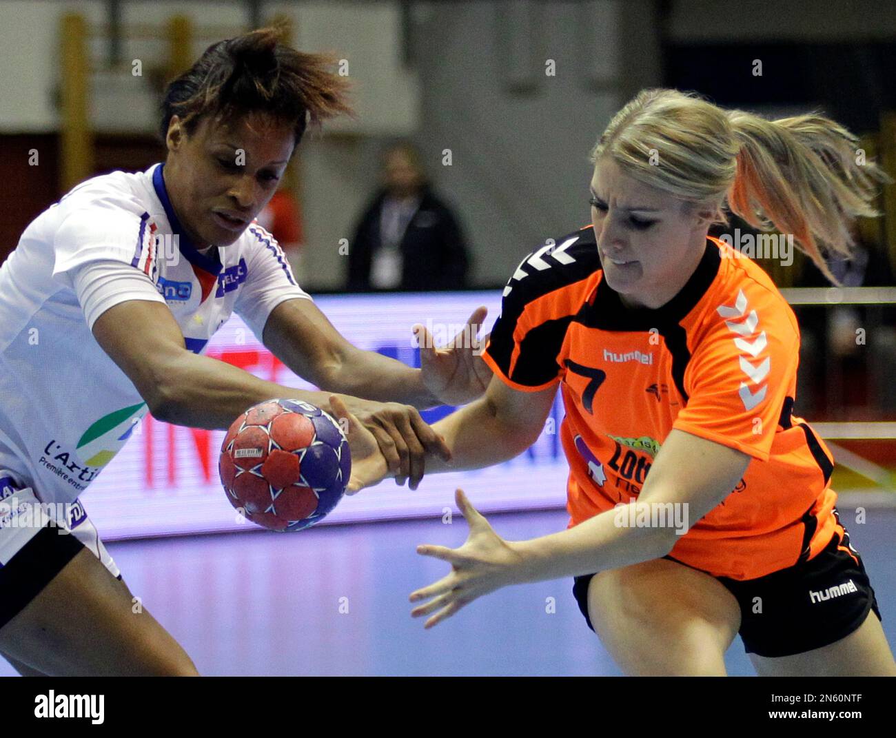 France's Alison Pineau, left and Dutch Cornelia Groot challenge for the ...