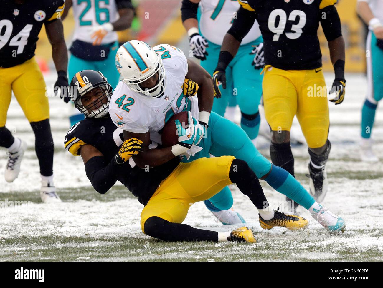 Miami Dolphins tight end Charles Clay (42) is tackled by Pittsburgh ...