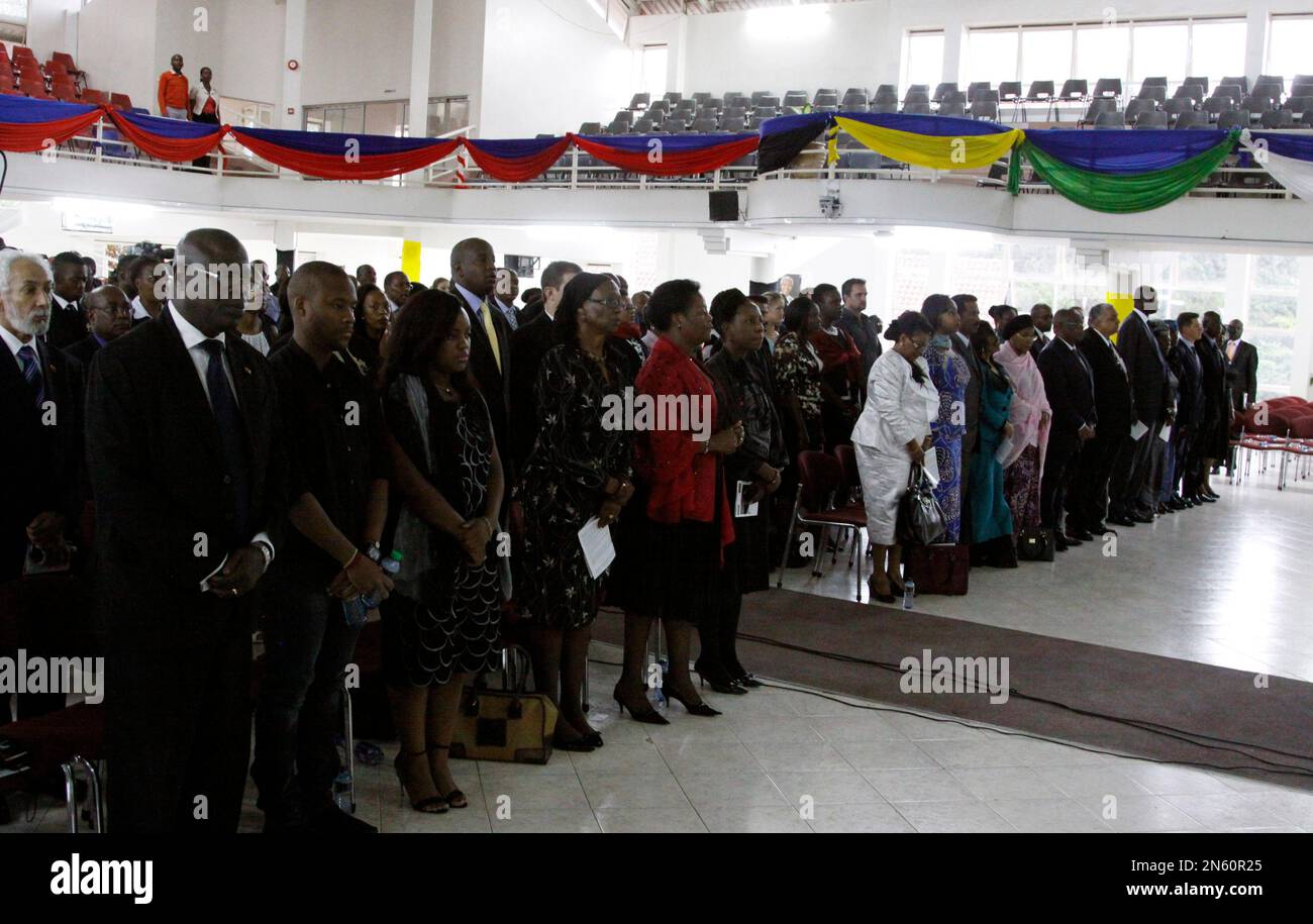 People stand during a memorial service for former South African ...