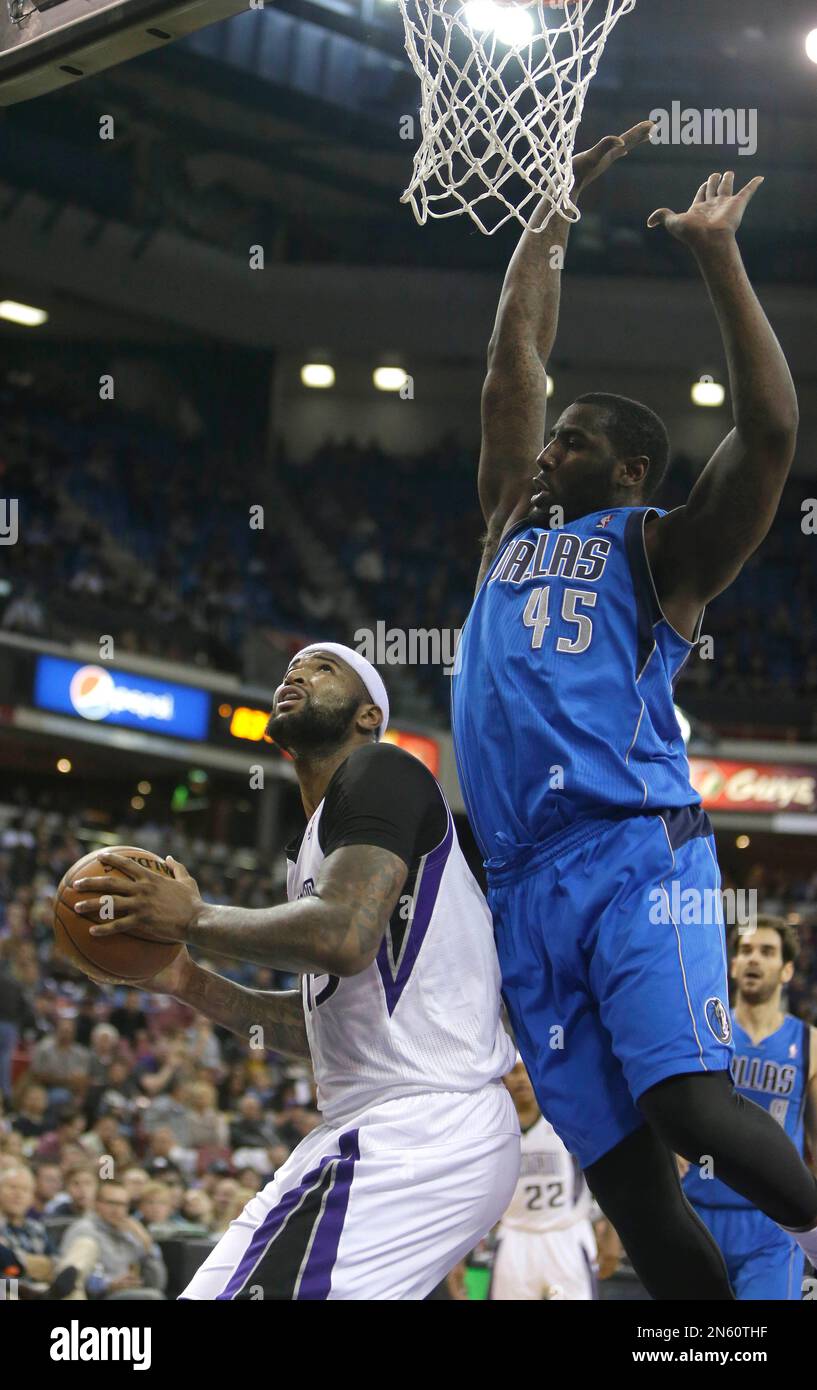 Dallas Mavericks forward DeJuan Blair, right, goes high to stop the ...