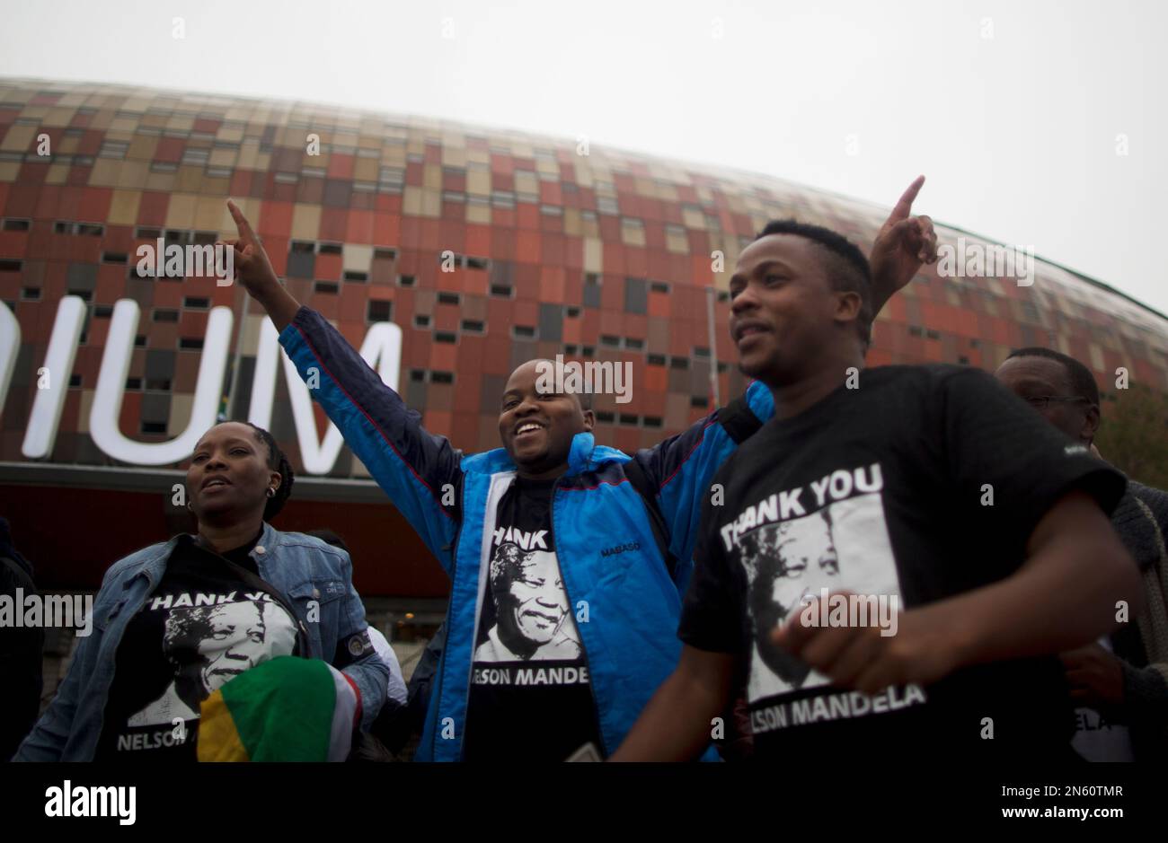 Mourners arrive at FNB Stadium for the memorial service for former ...