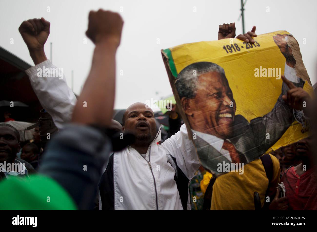 A mourner chants outside of FNB Stadium as they wait for the memorial ...