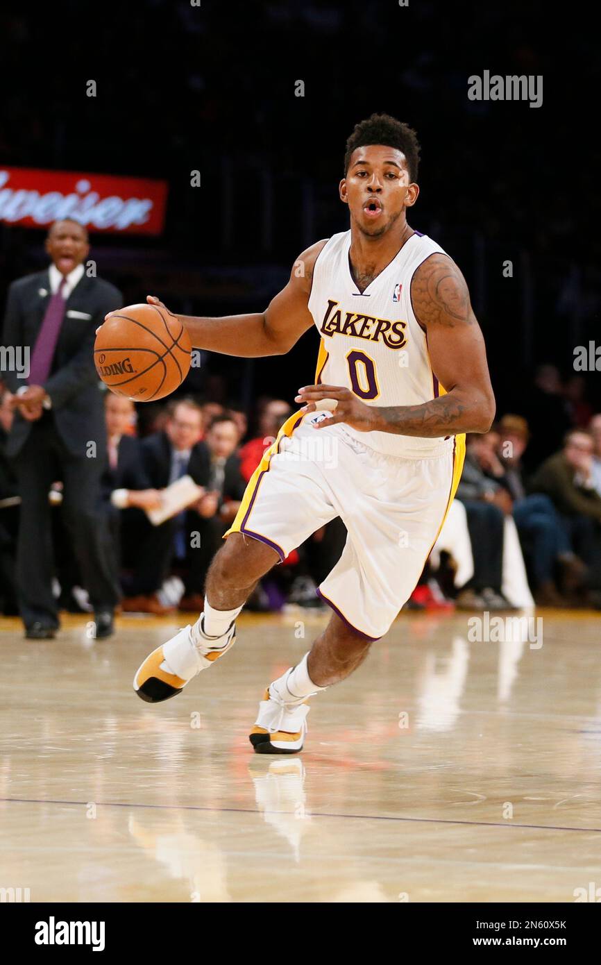 Los Angeles Lakers' Nick Young dribbles the ball against Toronto ...