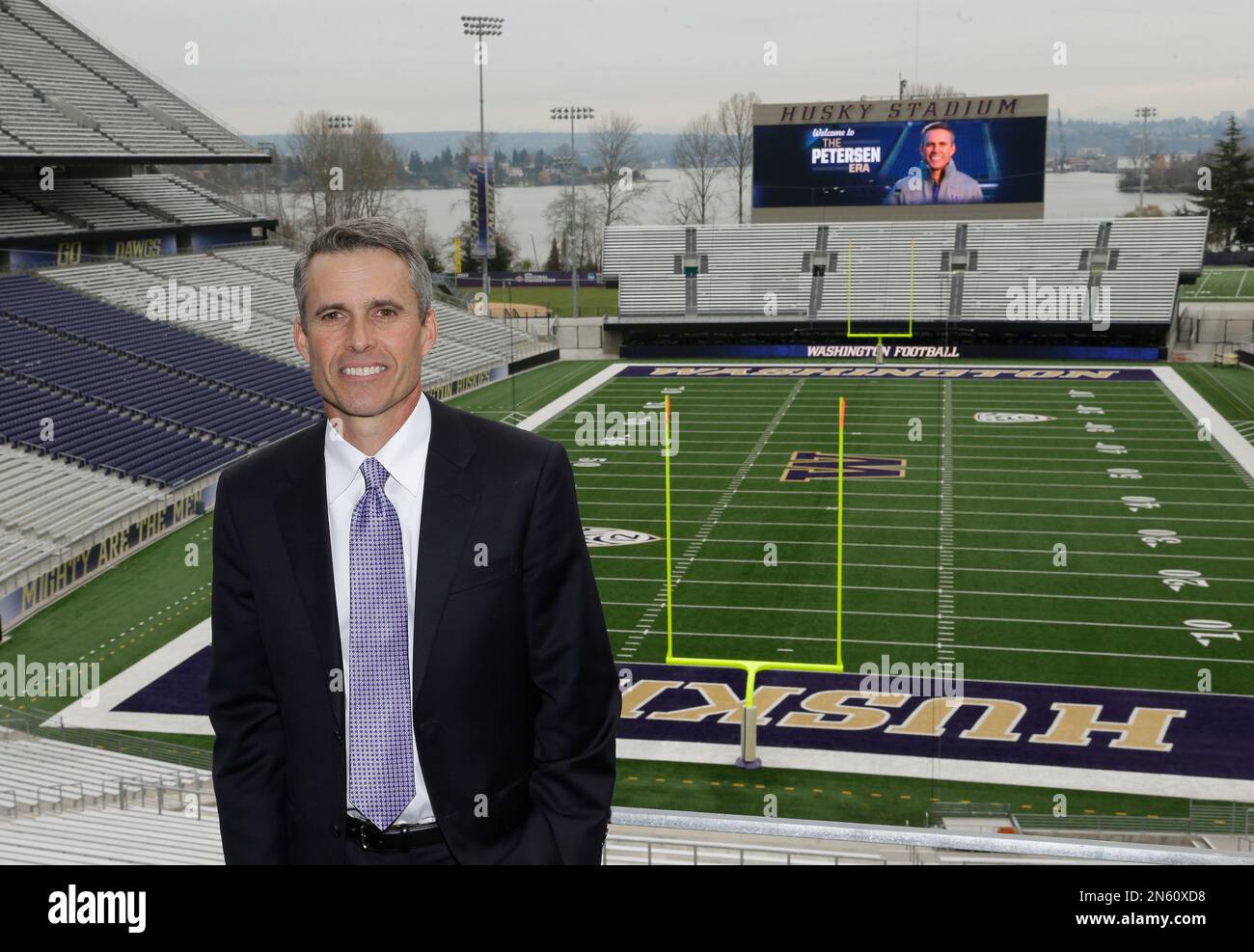 New University of Washington head football coach Chris Petersen poses ...