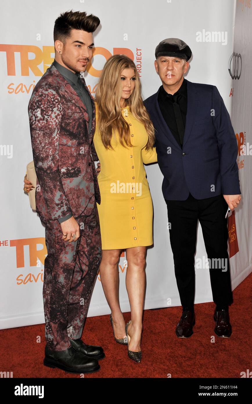 From left, Adam Lambert, Fergie, and Ryan Murphy arrive at TrevorLIVE ...