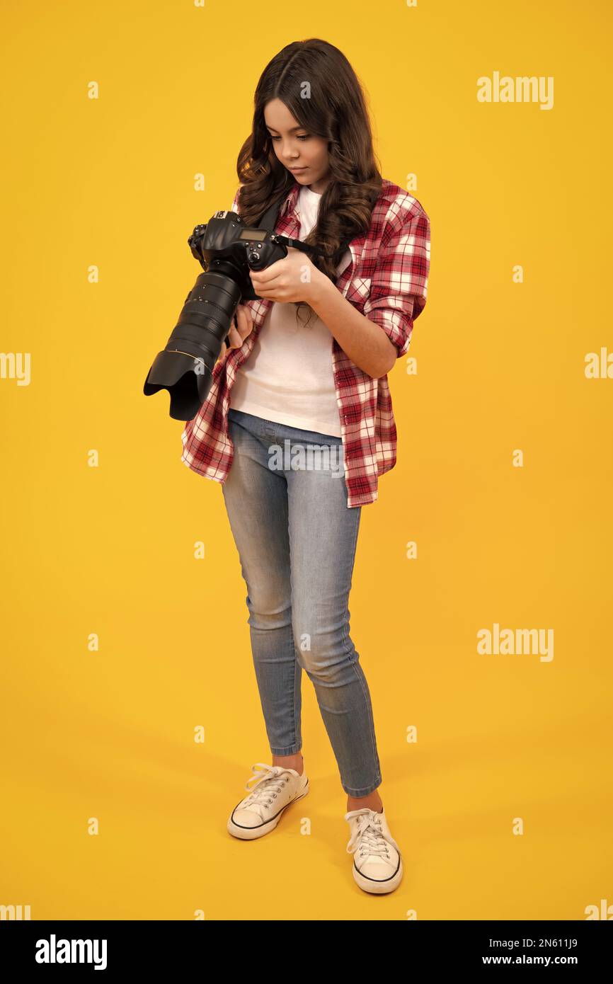 Teenager lifestyle, teen hipster hold professional camera. Girl with ...