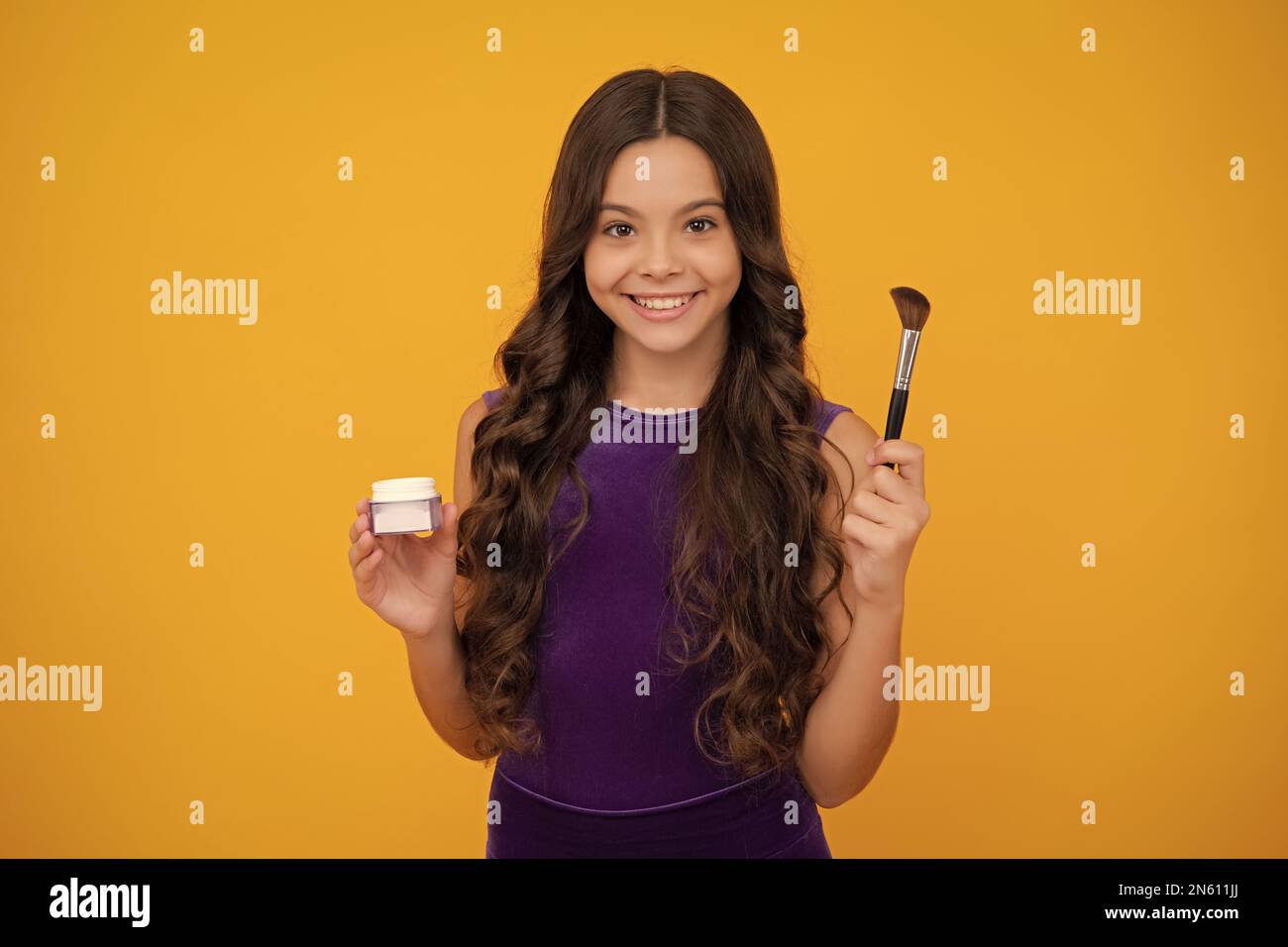 Beautiful portrait of teen girl child artist apply powder with make up ...
