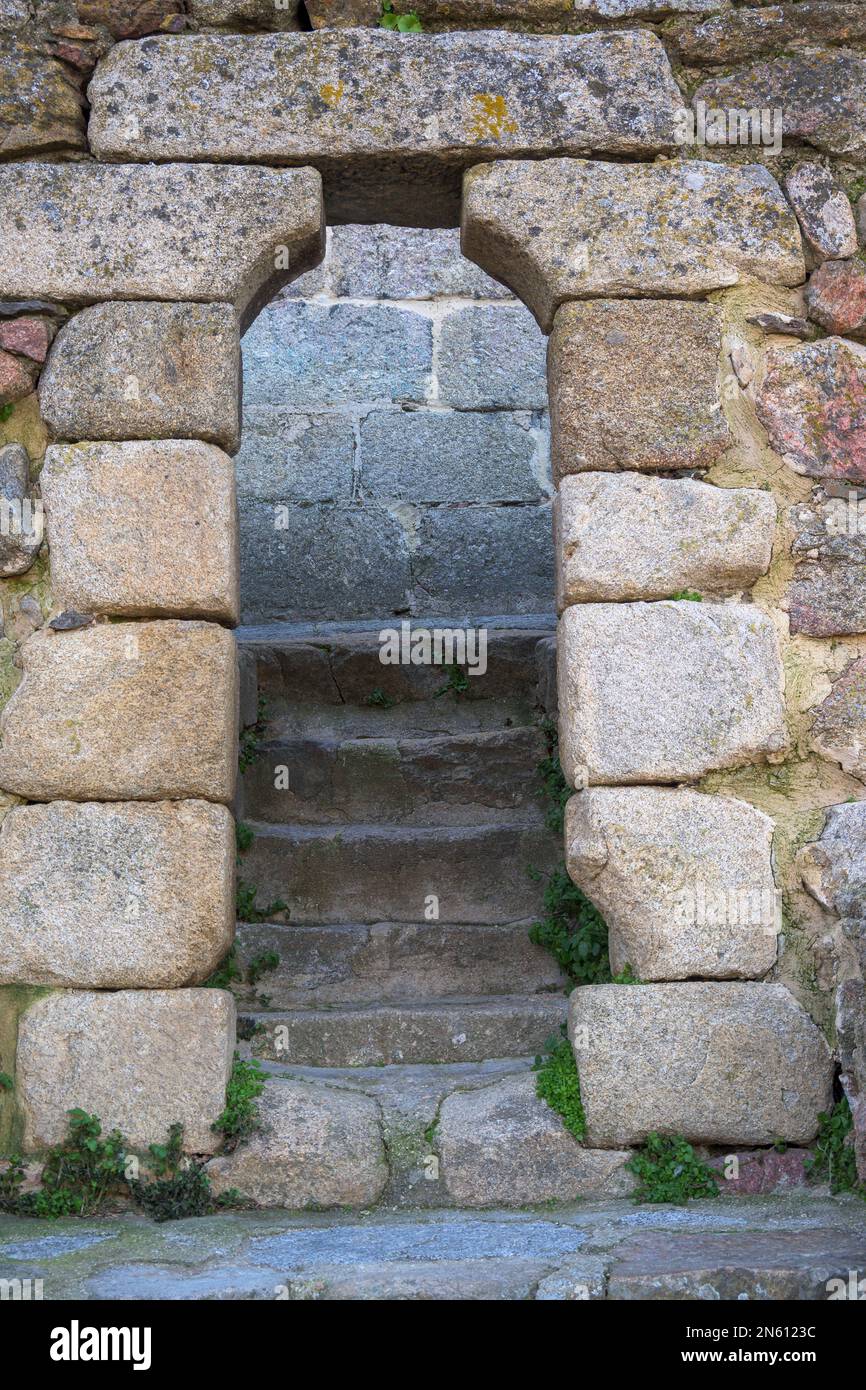 Stone arch with stairs to climb bell tower of church of Santa Maria in ...