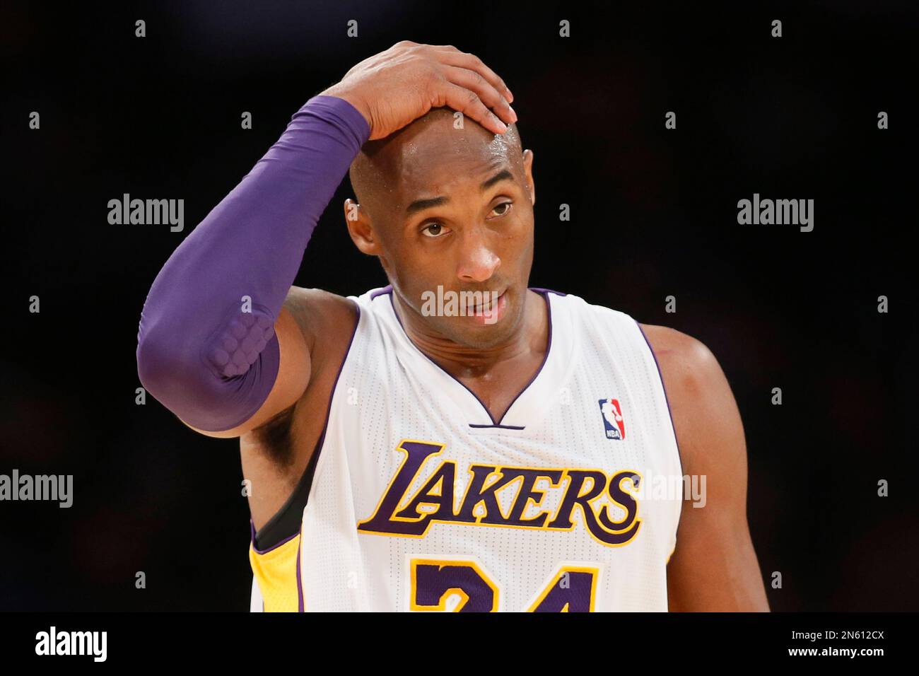 Los Angeles Lakers' Kobe Bryant wipes sweat off his head during his ...