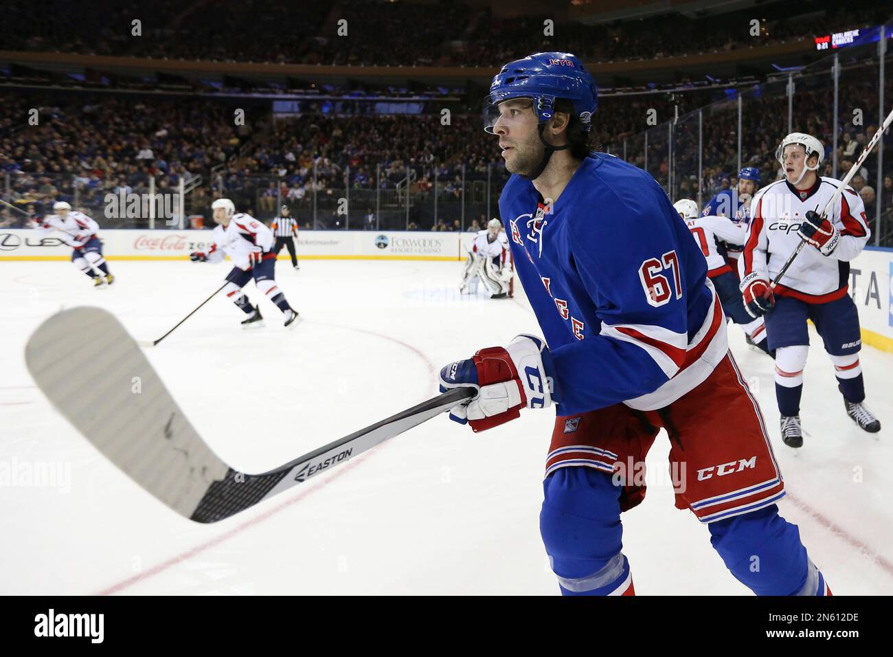 New York Rangers left wing Benoit Pouliot (67) skates up the ice in the ...