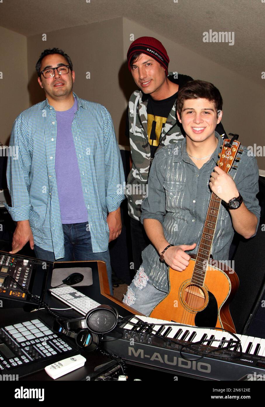 (L-R) Mixing engineer Benny Steele, singer and musician Tyler Layne and ...