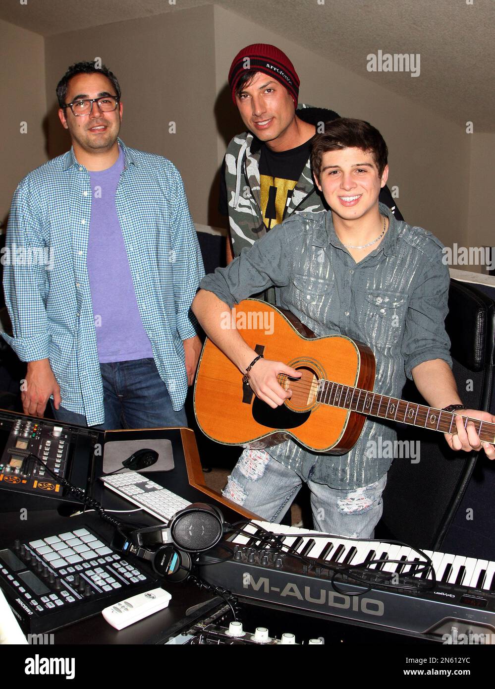 (L-R) Mixing engineer Benny Steele, singer and musician Tyler Layne and ...