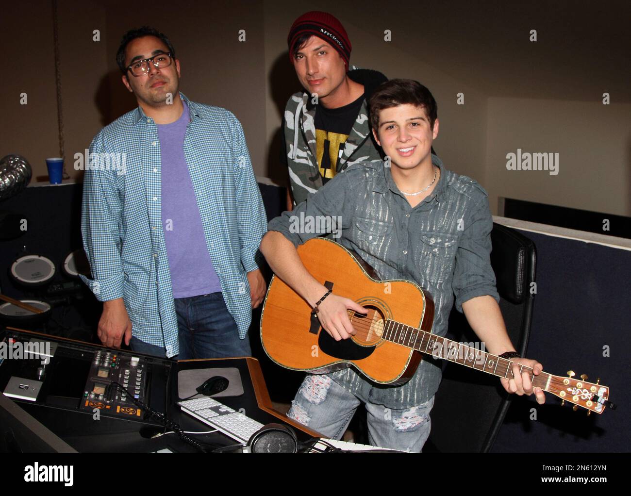 (L-R) Mixing engineer Benny Steele, singer and musician Tyler Layne and ...