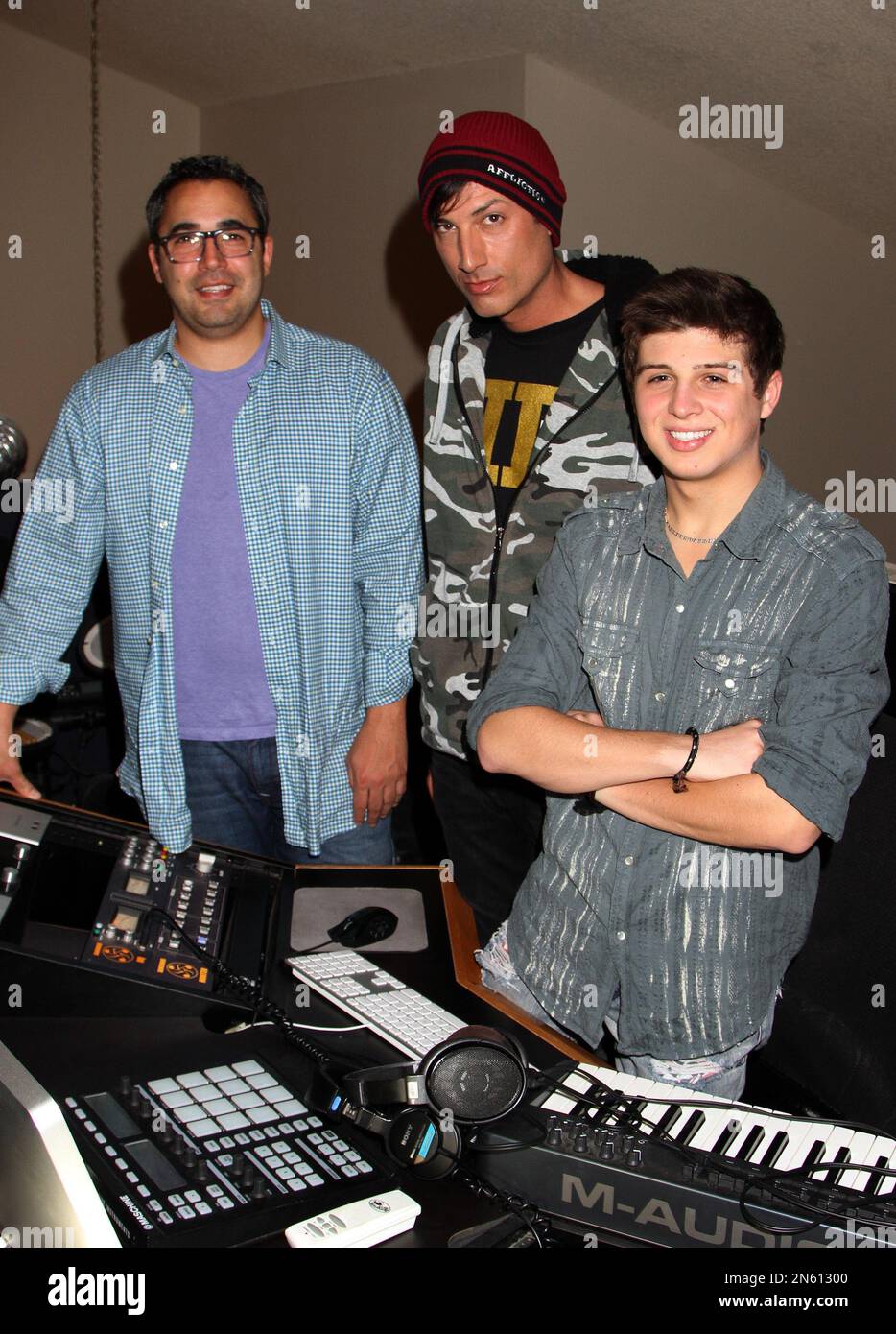 (L-R) Mixing engineer Benny Steele, singer and musician Tyler Layne and ...
