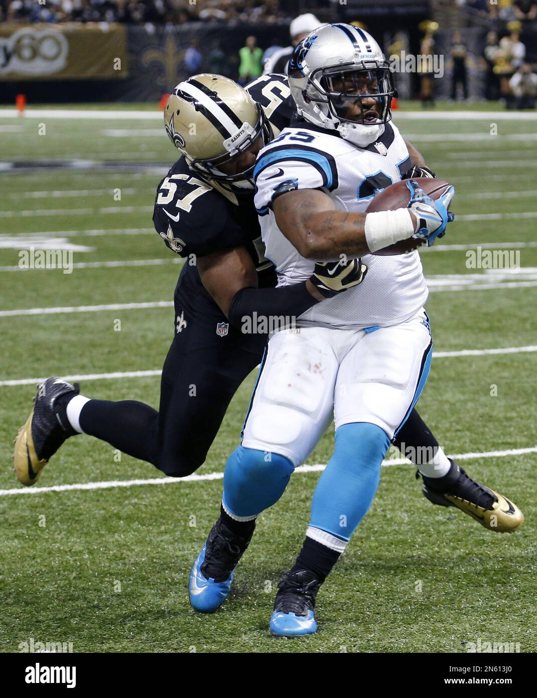 Carolina Panthers fullback Mike Tolbert (35) carries as he is tackled ...