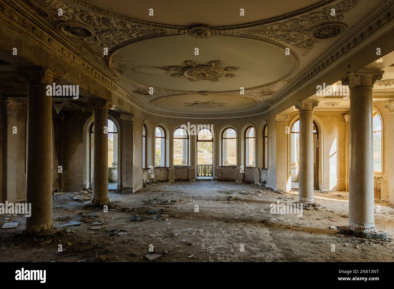 Large hall with columns in old abandoned mansion Stock Photo - Alamy