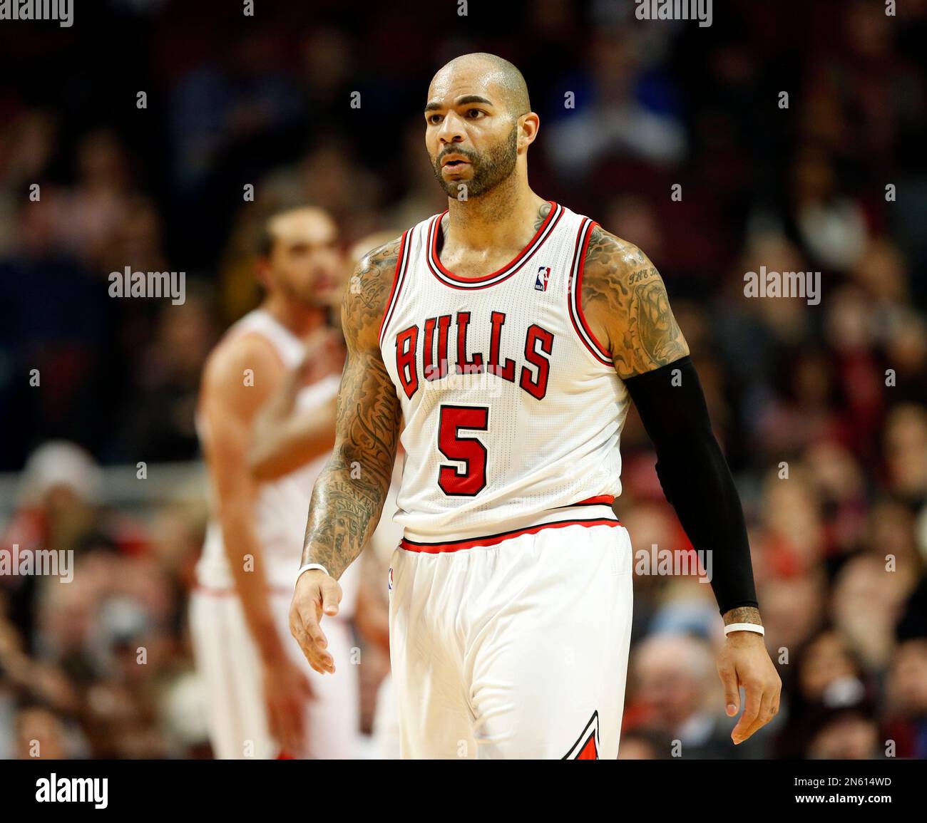 Chicago Bulls forward Carlos Boozer walks on the court during an NBA ...