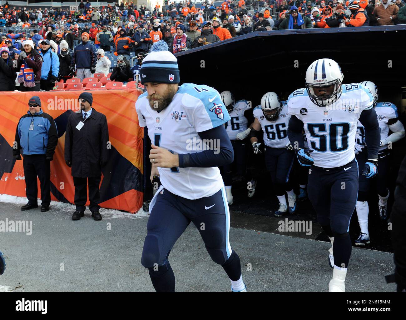 Tennessee Titans quarterback Ryan Fitzpatrick runs into the field ...