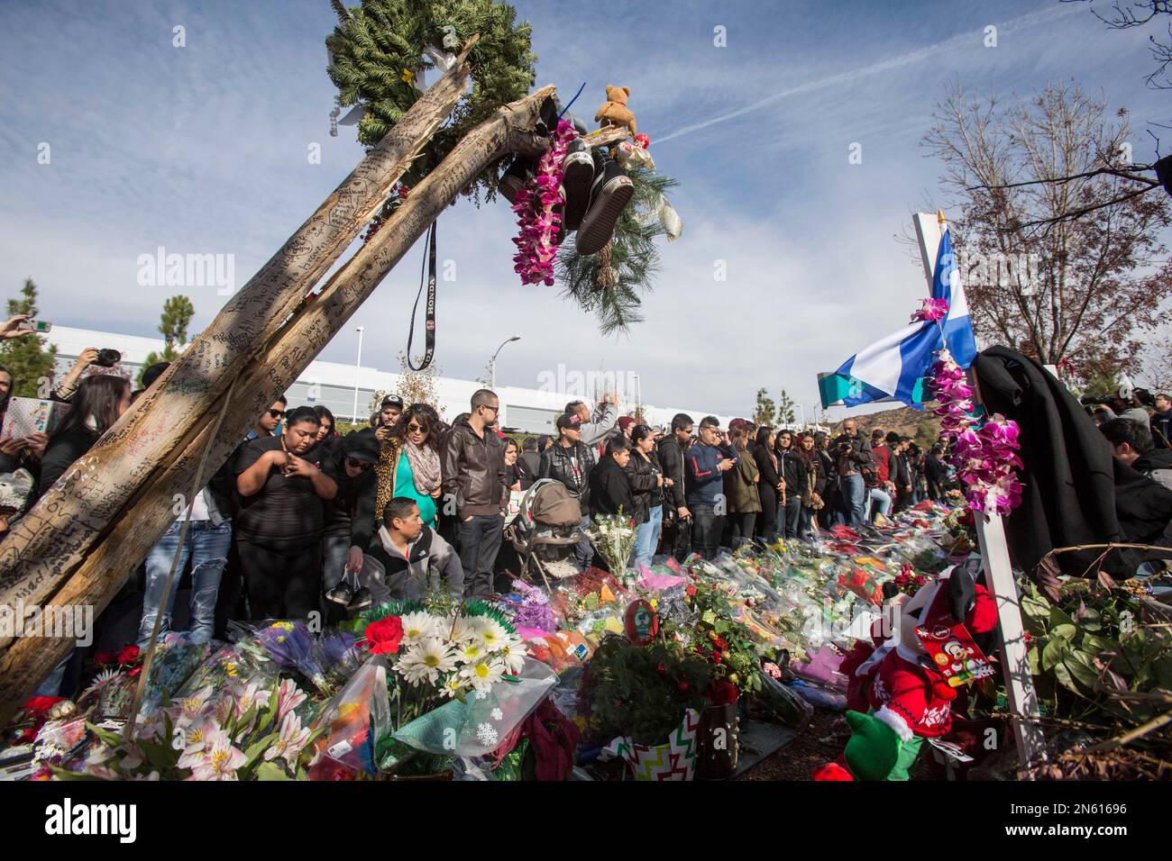 Fans crowd the scene of a memorial rally and car cruise in Valencia ...