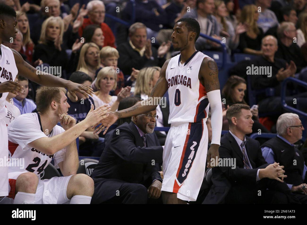 Gonzaga’s Gerard Coleman (0) is greeted Gary Bell, Jr., left, and ...