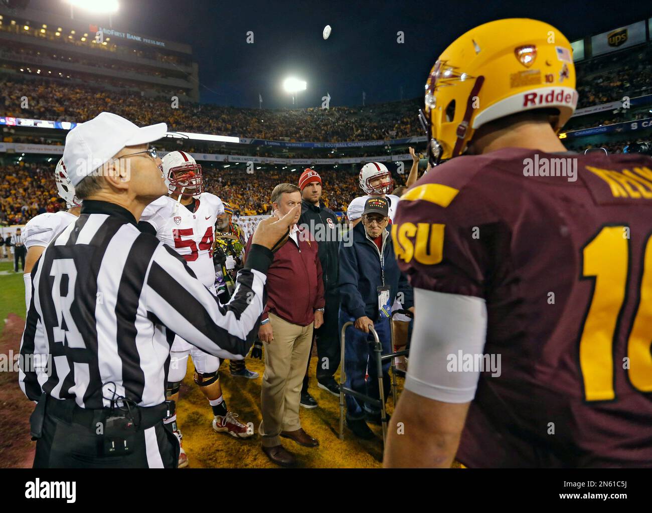 Referee Jay Stricherz flips the coin prior to the start of the NCAA Pac ...