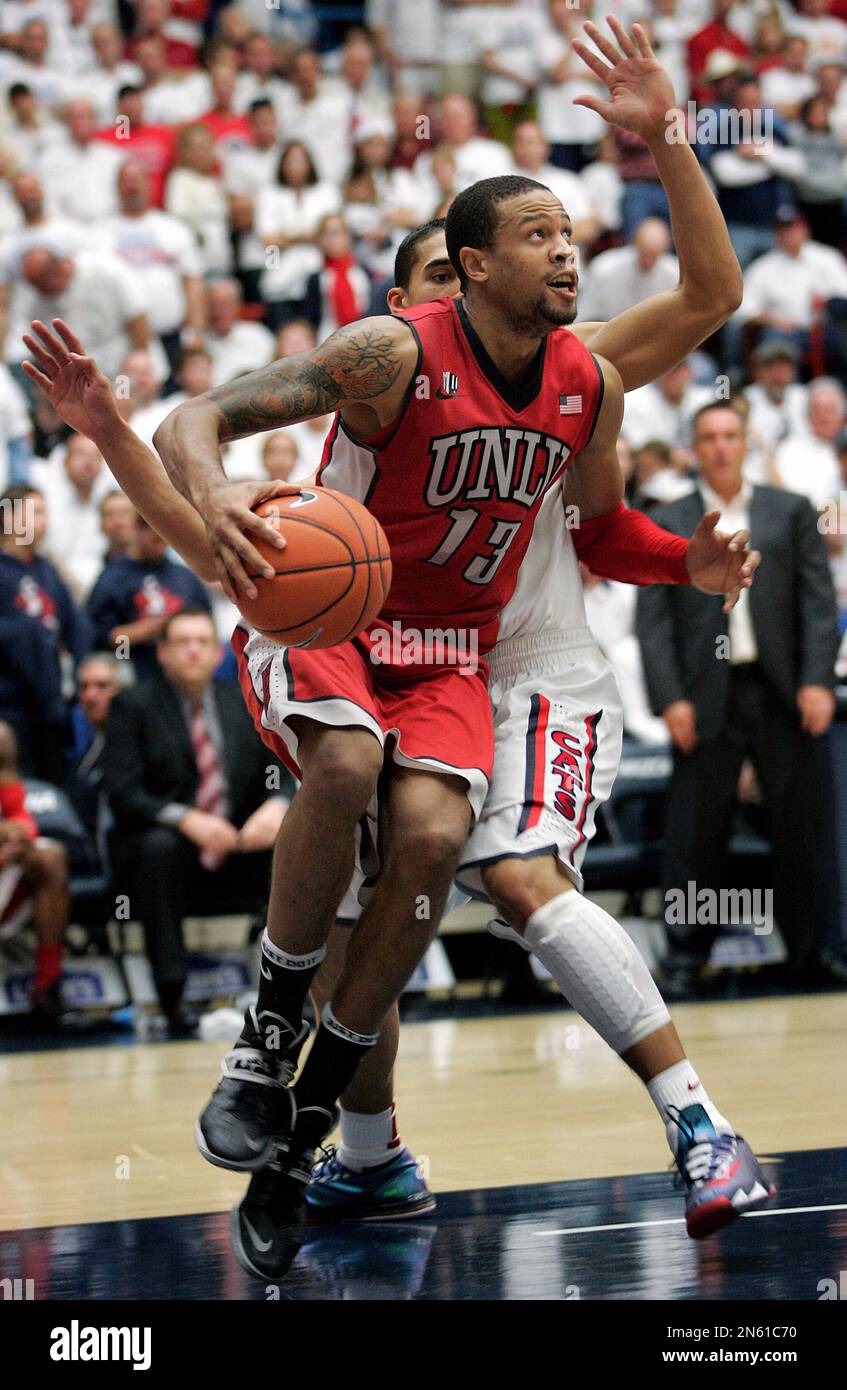 UNLV's Bryce Dejean-Jones (13) looks to shoot for two points against ...